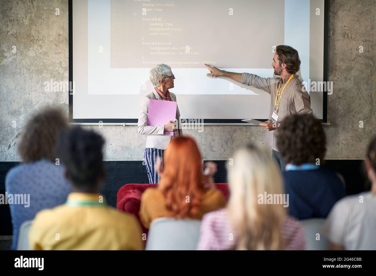 Company employees at a presentation in a working atmosphere in the ...