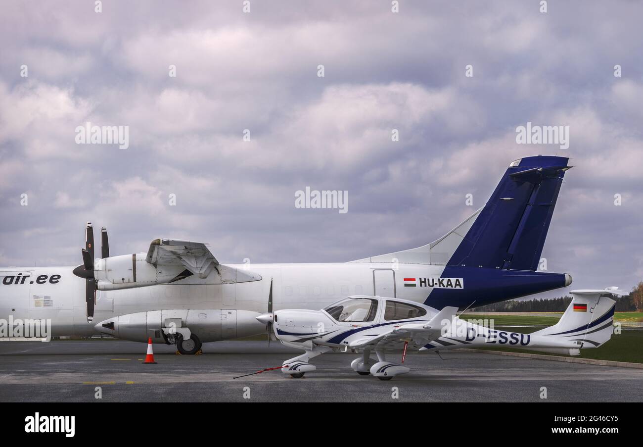 The small and the big plane Stock Photo - Alamy