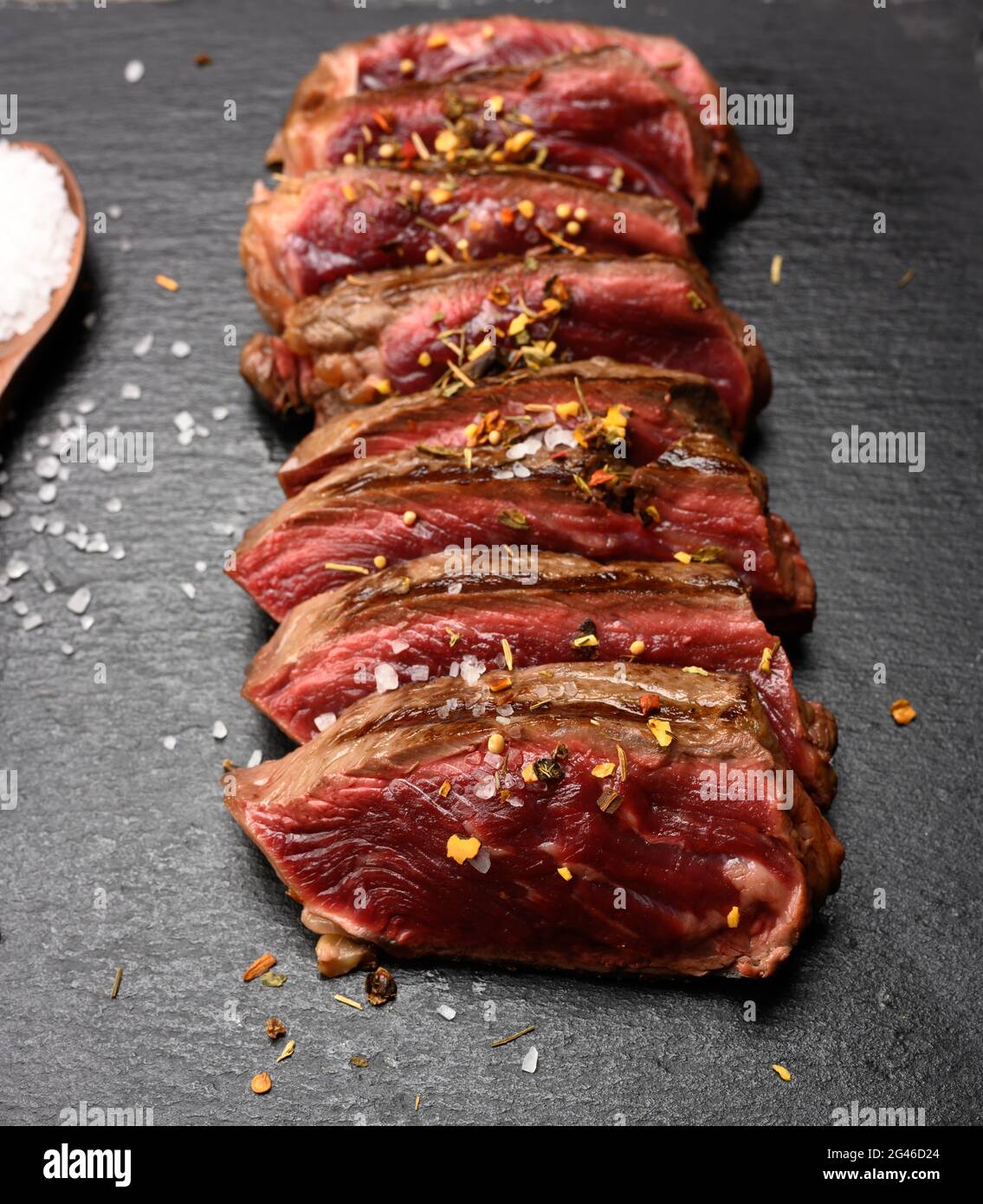 Classic beef steak uncooked meat (fried outside, red inside) with red ...
