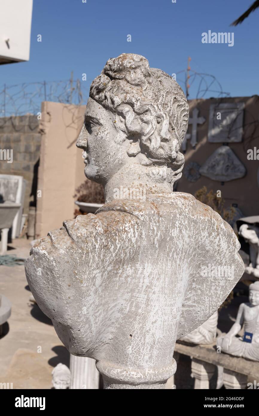 Ancient stone sculpture of man's bust in reclamation yard Stock Photo ...