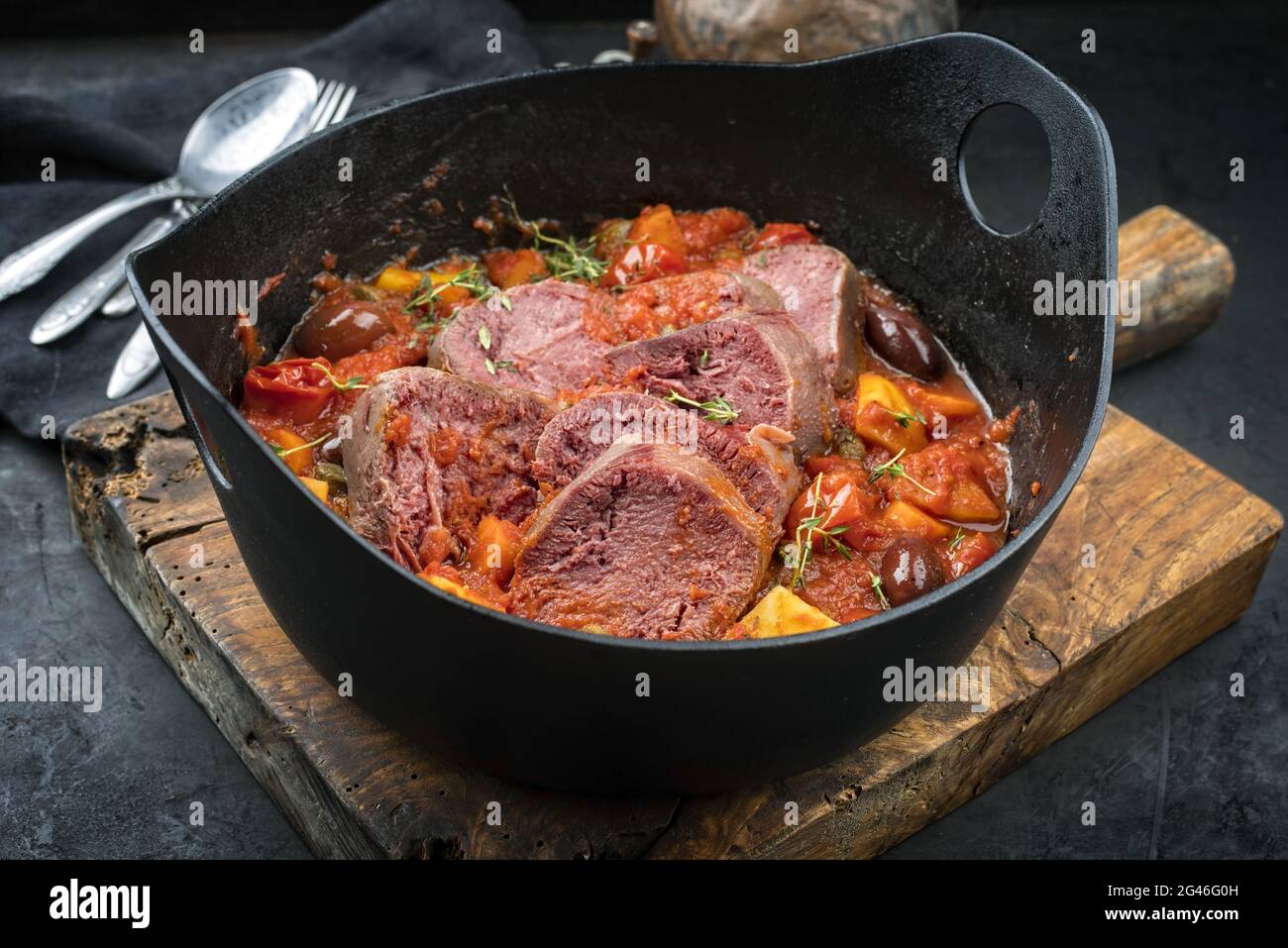Modern style traditional Peruvian estofado de lengua cooked beef tongue ...