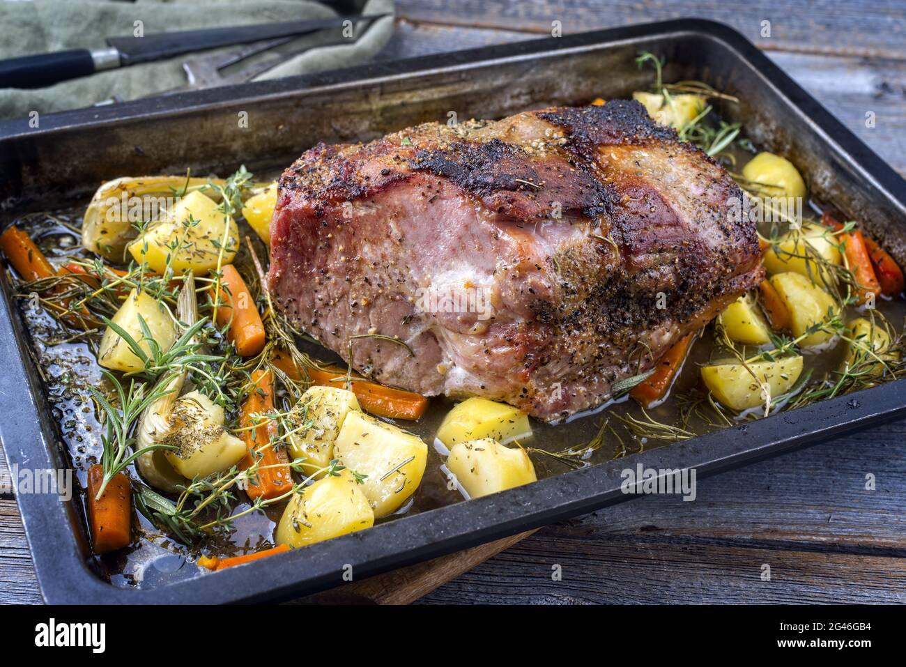 Traditional corned pot pork roast offered with potatoes Stock Photo - Alamy
