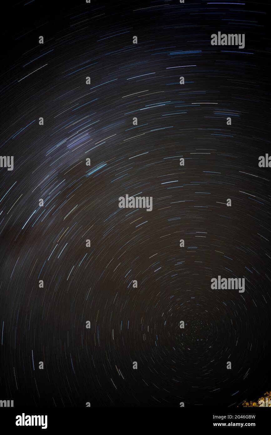 Long exposure star spiralling during night sky Stock Photo - Alamy