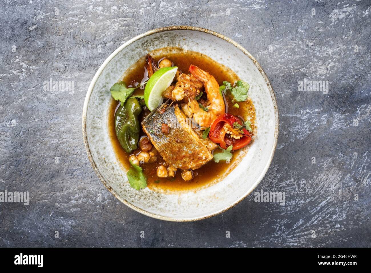 Modern style traditional Mexican seafood pozole soup with fish Stock ...