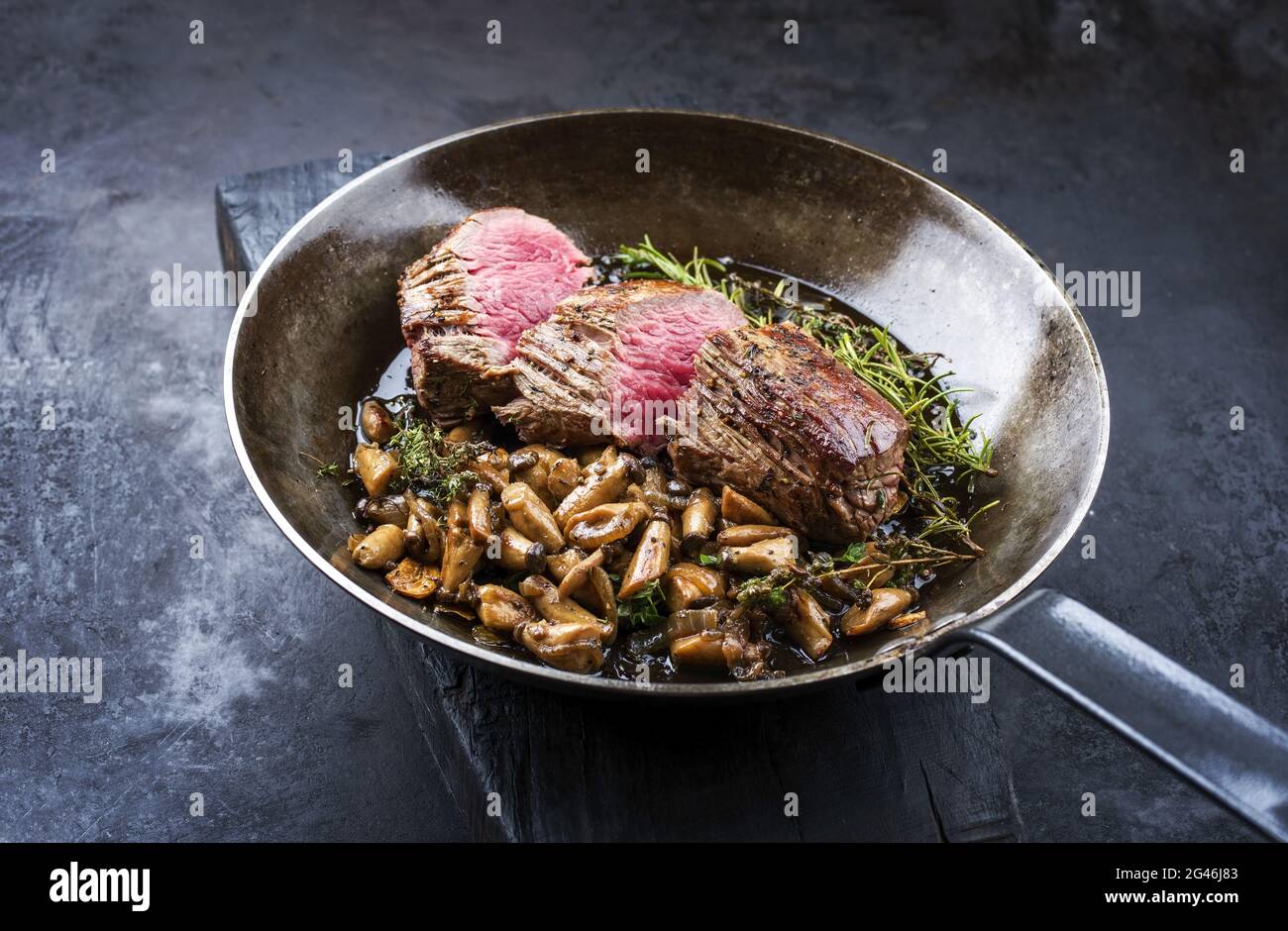 Fried dry aged beef fillet steak natural with king trumpet mushroom and ...
