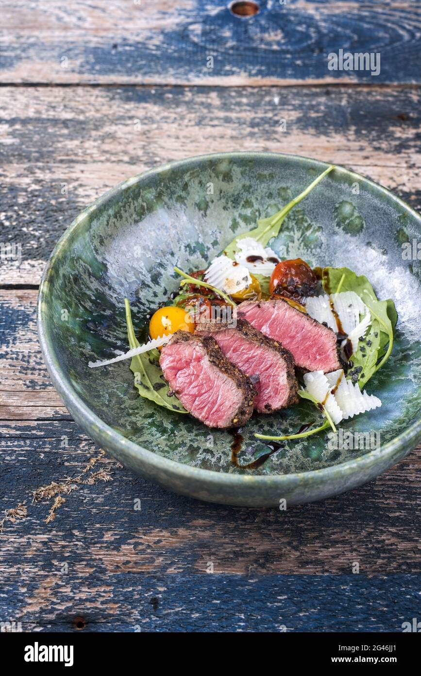 Modern Style Italian tagliata di manzo with dry aged sliced sirloin ...