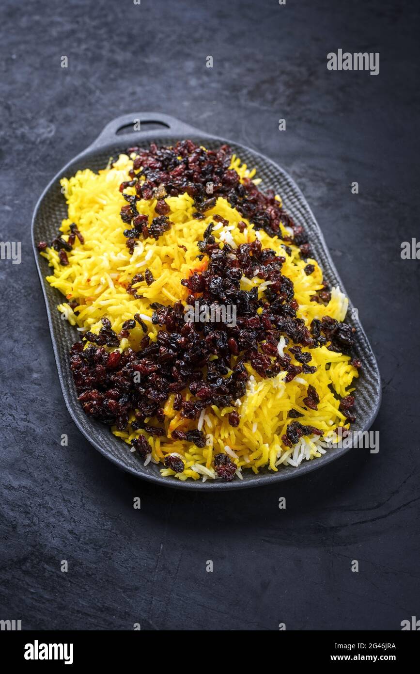 Modern style traditional Persian steamed saffron rice with berberis ...