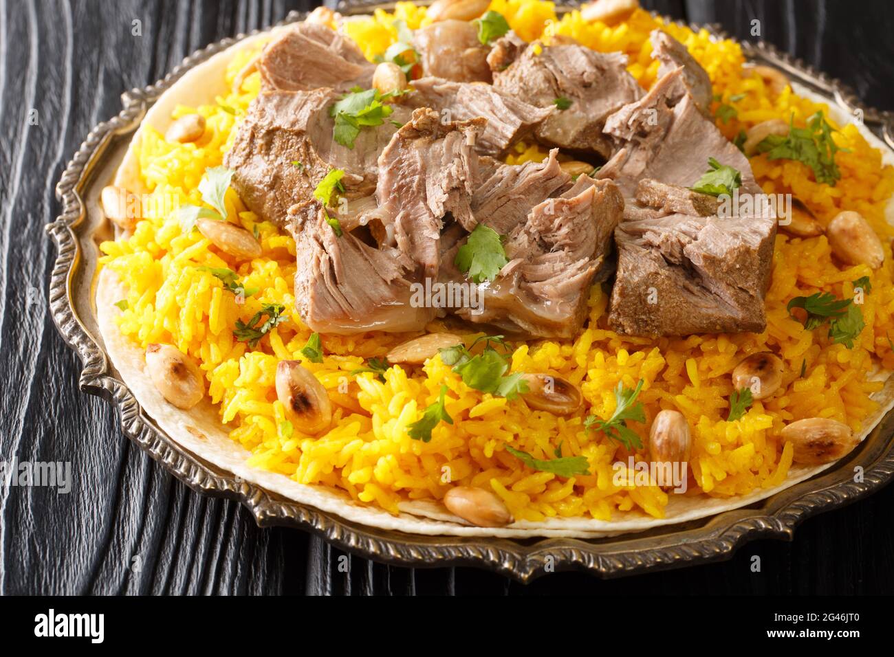 Mansaf is a dish of rice, lamb, and a dry yoghurt made into a sauce ...