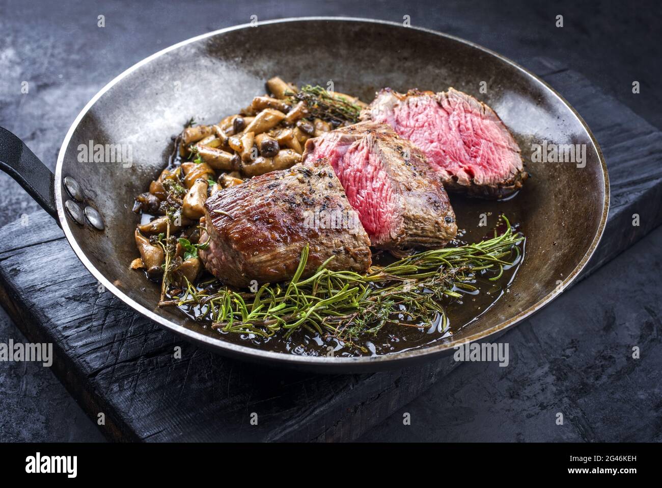 Fried dry aged beef fillet steak natural with king trumpet mushroom and ...