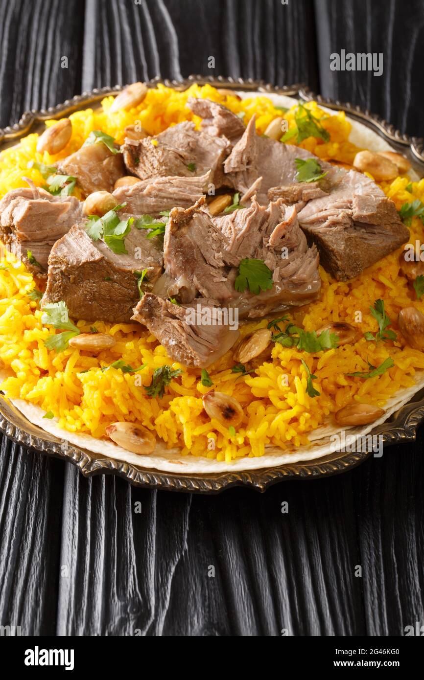 Mansaf is a traditional Arab dish made of lamb cooked in a sauce of ...