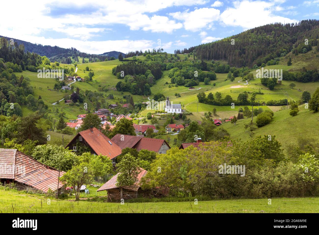 Idyll mountain landscape, rural summer scene in Germany. Green hills, blue sky, forest, green ...
