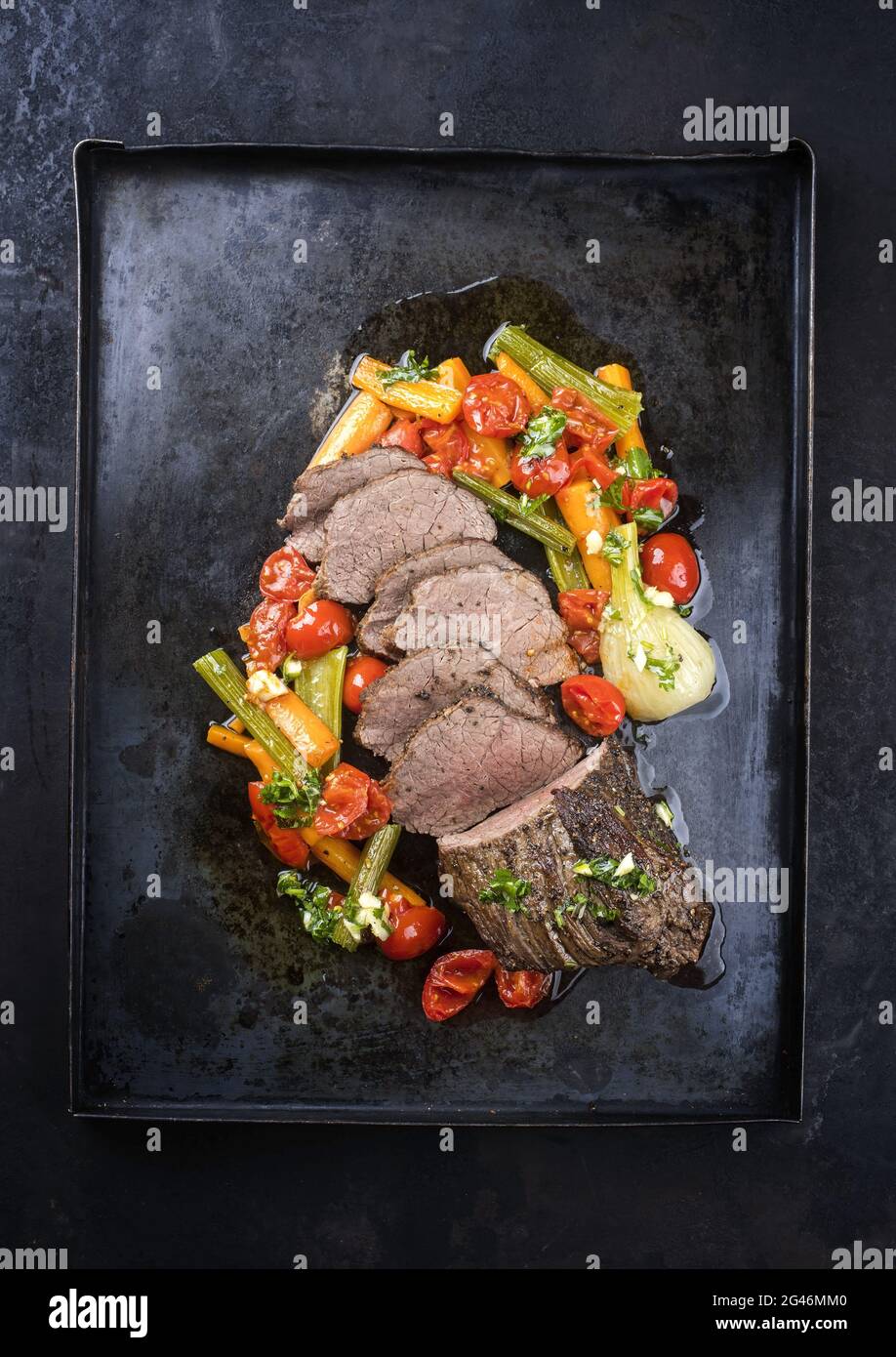 Roast slow cook angus sirloin cap of rump beef sliced and served with ...