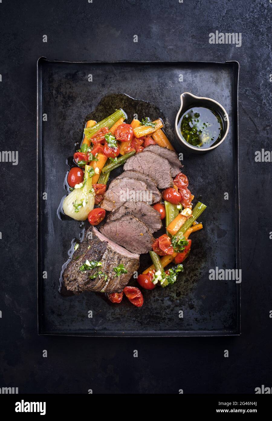 Roast slow cook angus sirloin cap of rump beef sliced and served with ...