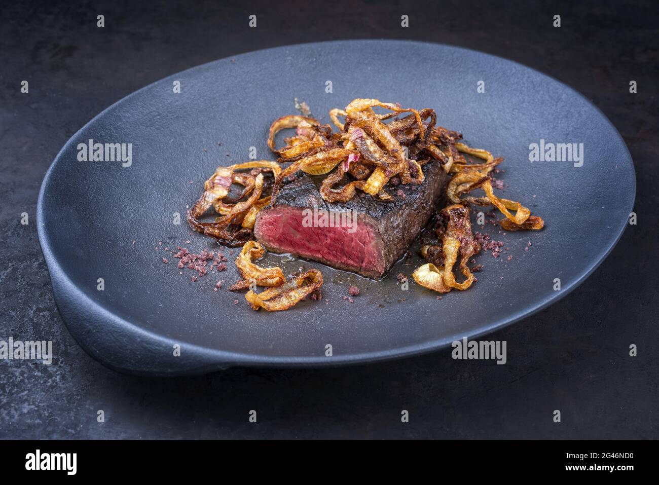 Modern style traditional dry aged sliced beef tenderloin with fried ...