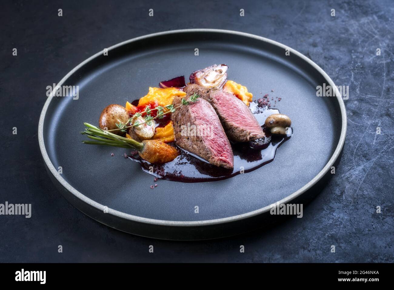 Modern style traditional wild hare back filet braised with wild berries ...