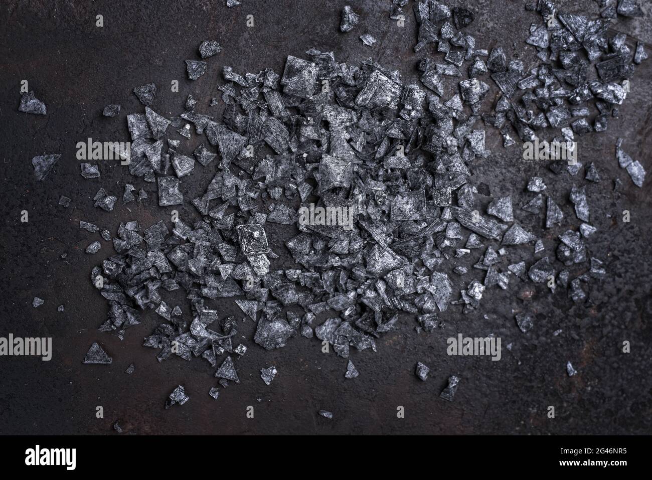 Traditional gourmet pyramid salt flakes offered as close-up on a rustic ...