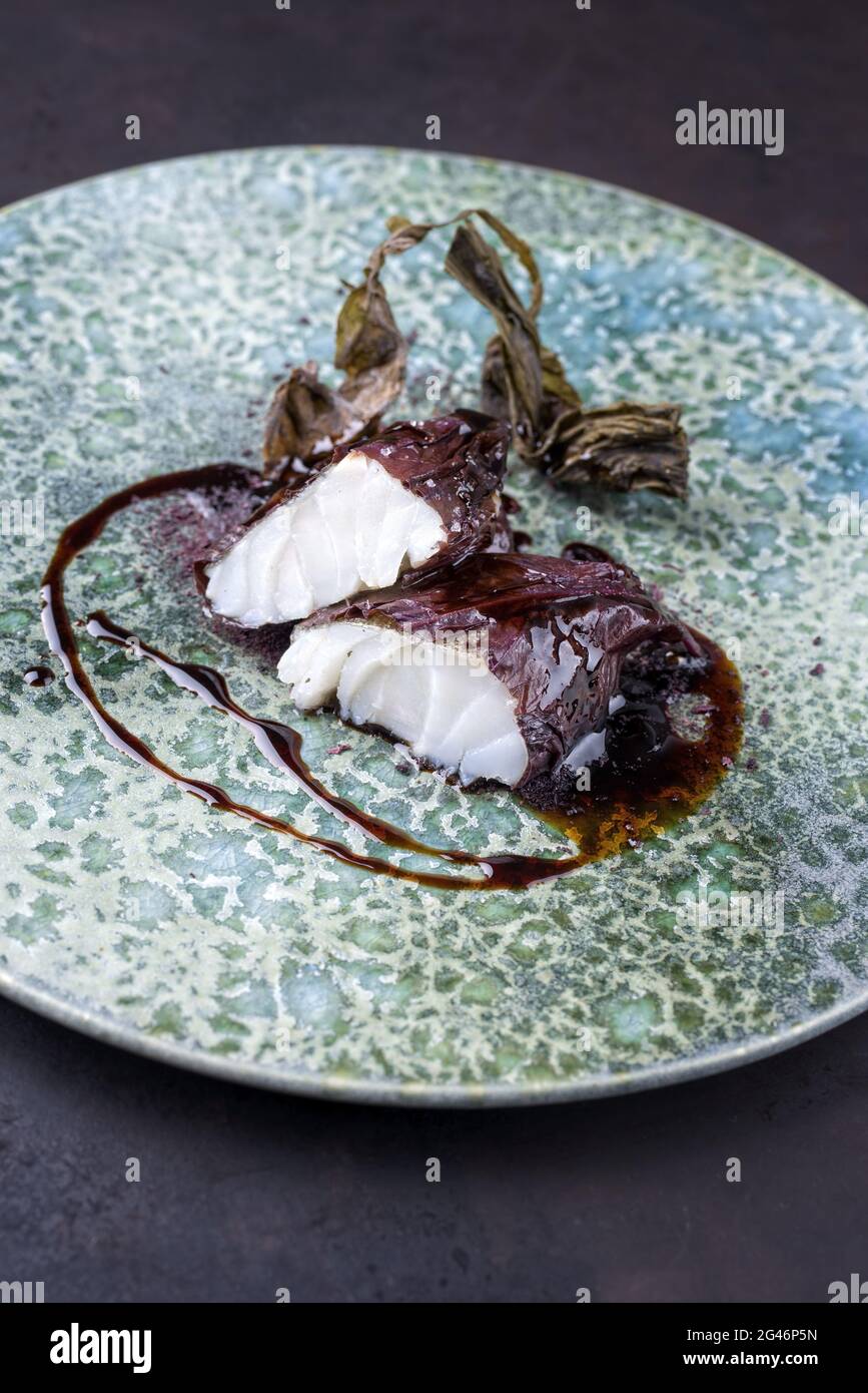 Modern style traditional sauteed skrei cod fish filet with shiso Stock ...