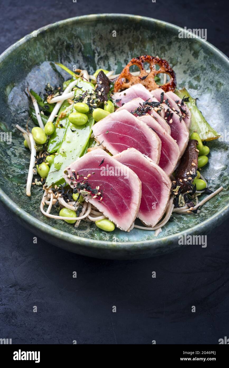 Modern style traditional Japanese gourmet seared tuna fish steak tataki ...