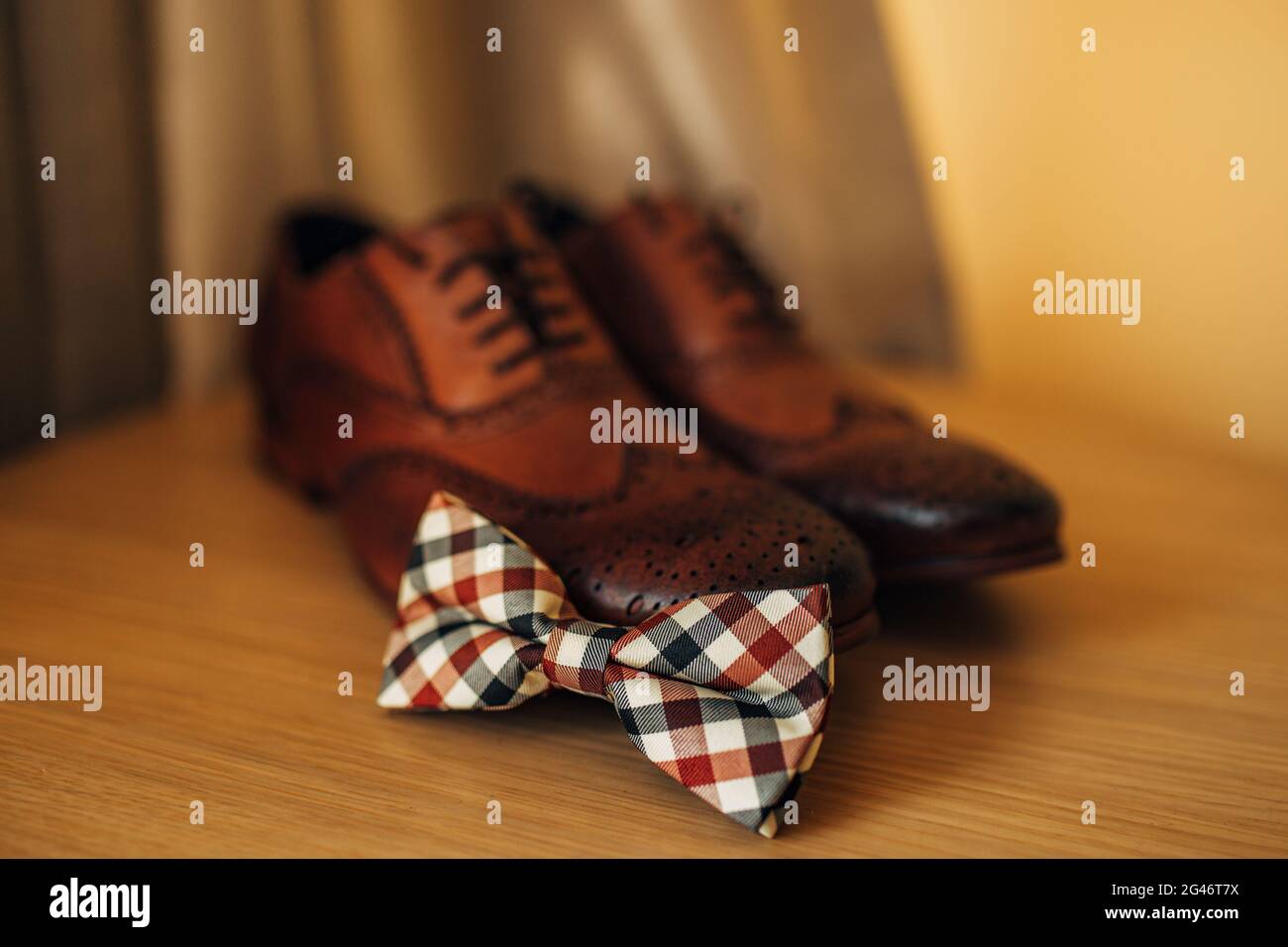Bow tie and brown shoes Stock Photo - Alamy