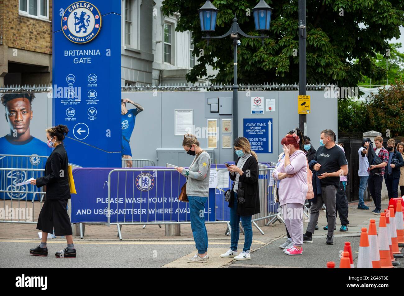 London, UK. 19 June 2021. People queue up to receive a Pfizer vaccine ...