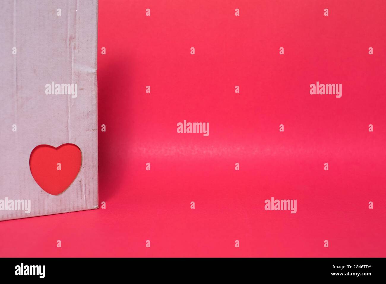 Closeup shot of a handmade card with heart-shape sticker on red ...