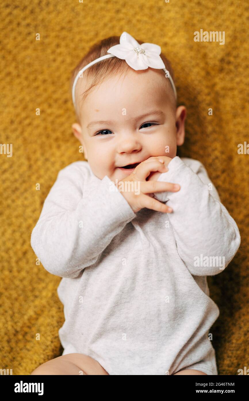 Baby chewing flower hi-res stock photography and images - Alamy