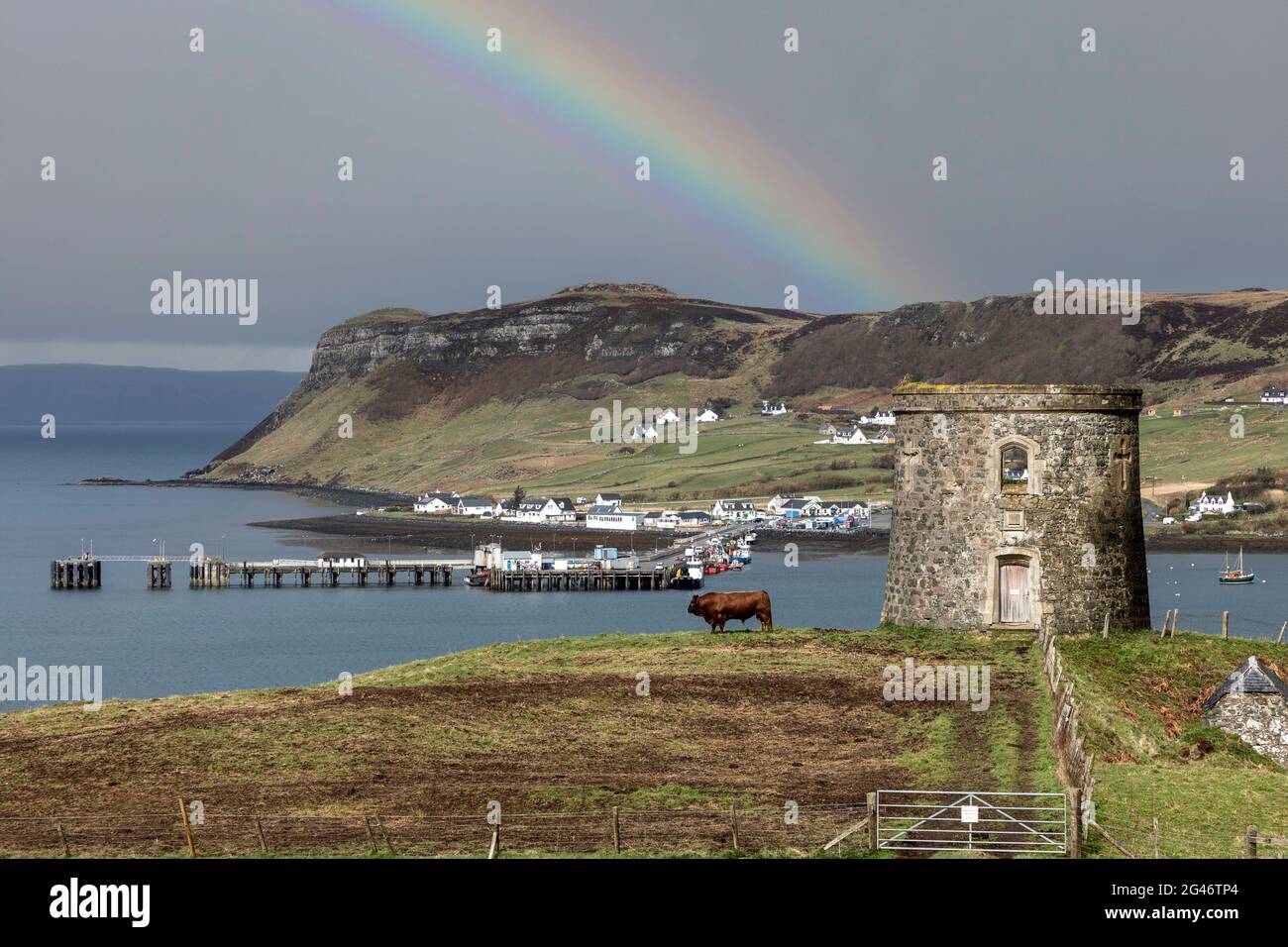 uig isle of skye in storm lighting with rainbow and folly tower Stock ...