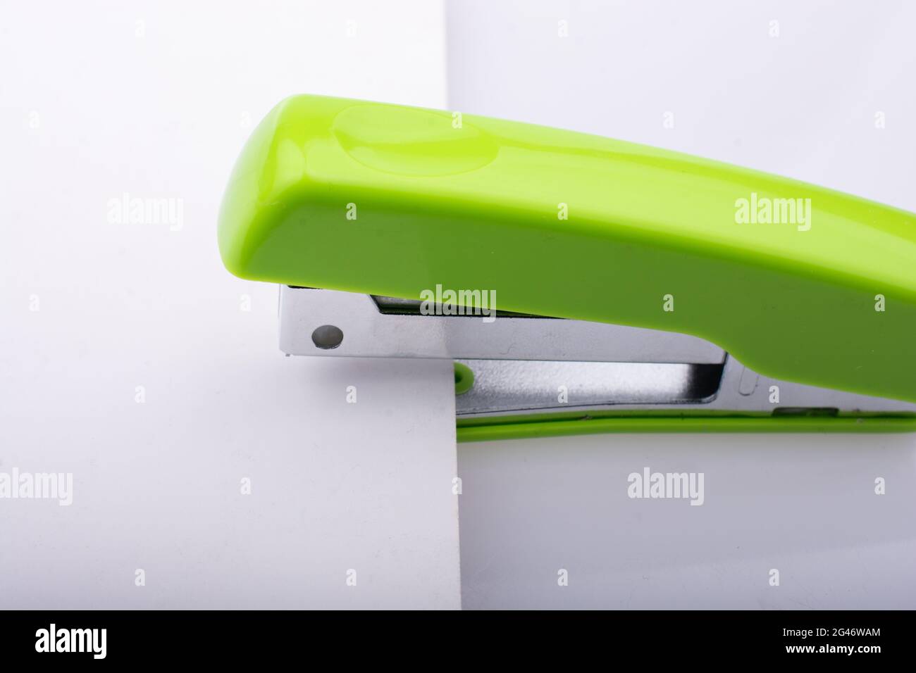 Closeup shot of a green stapler on a white background Stock Photo - Alamy