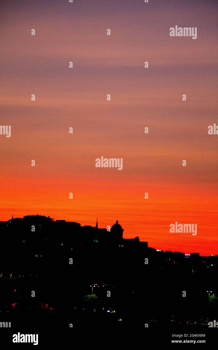 Silhouette of a town on a beautiful sunset background Stock Photo - Alamy