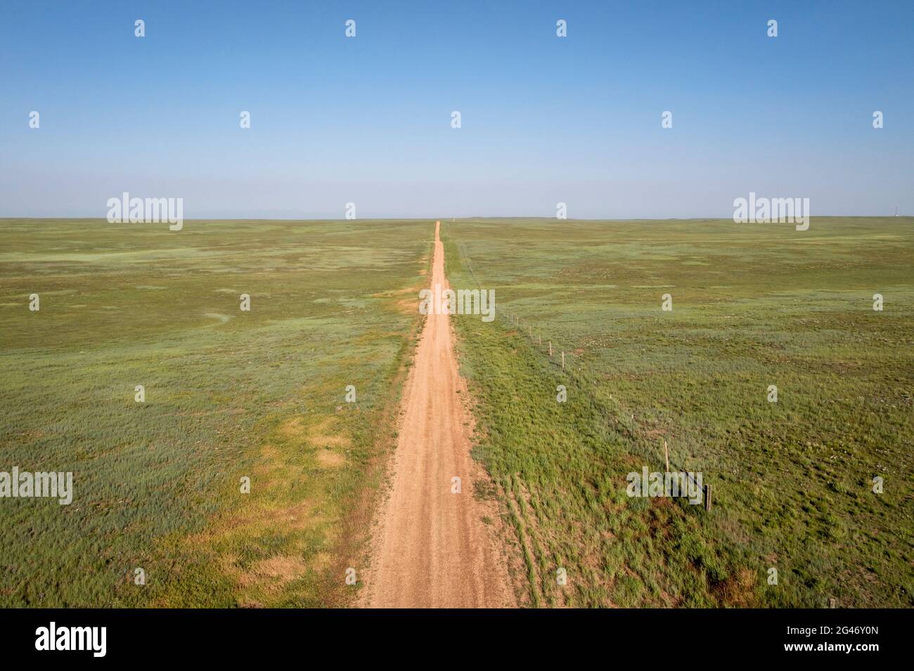 dirt remote road going through green prairie, Pawnee National Grassland ...