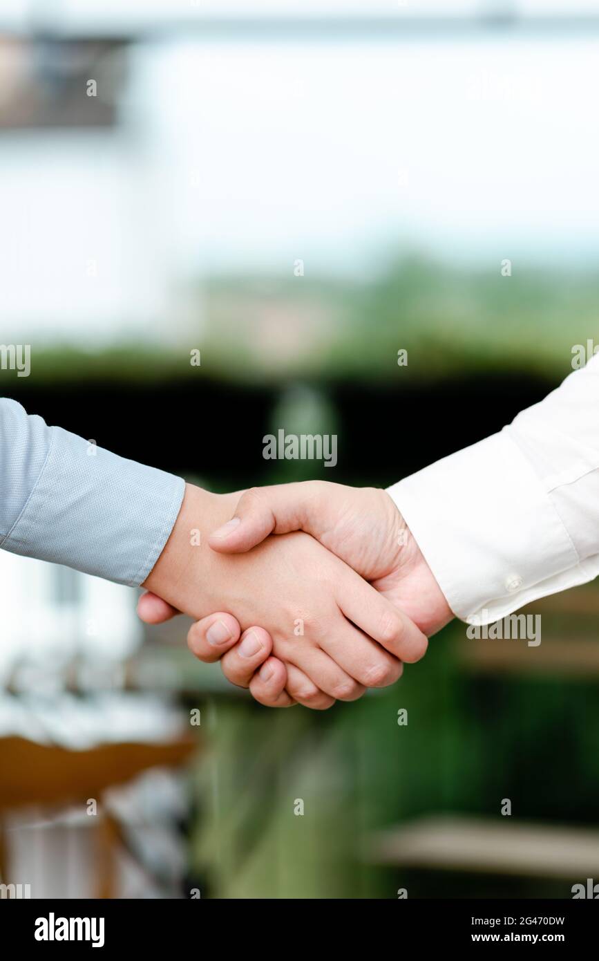 Two businessmen handshake sign hi-res stock photography and images - Alamy