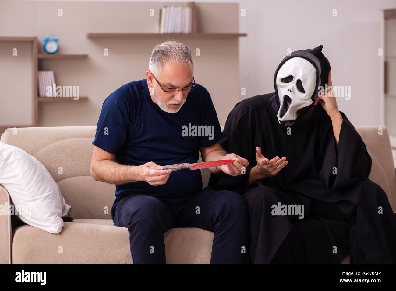 Devil coming to old dying man Stock Photo - Alamy