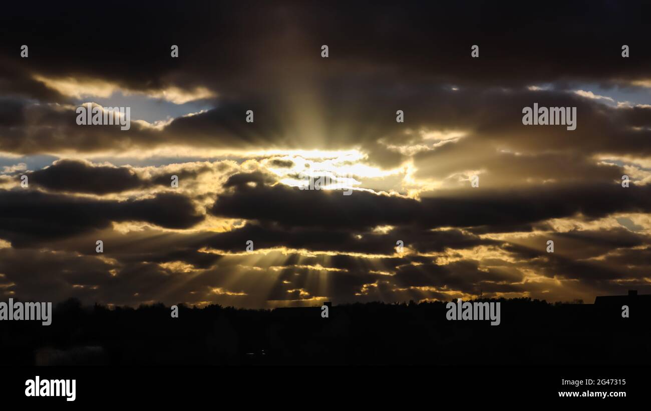Sunlight and dark clouds hi-res stock photography and images - Alamy