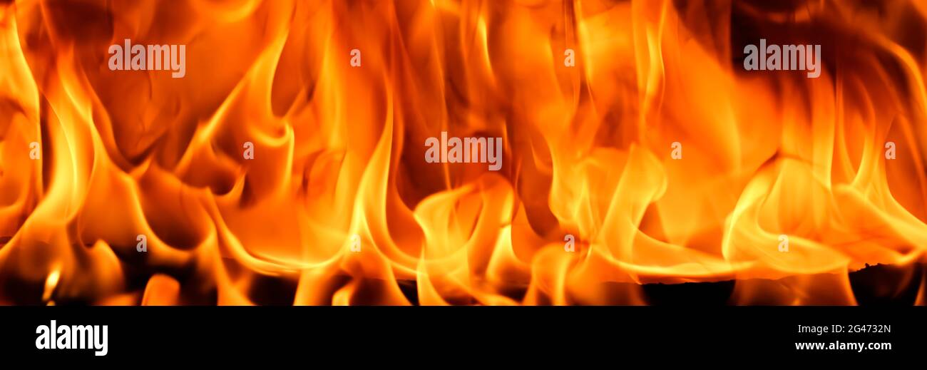 Red blaze Fire flame on a black background Stock Photo - Alamy