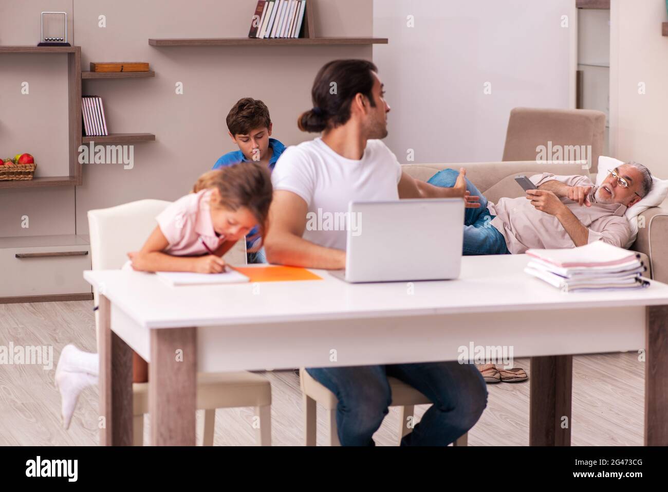 Three generations at home in early development concept Stock Photo - Alamy