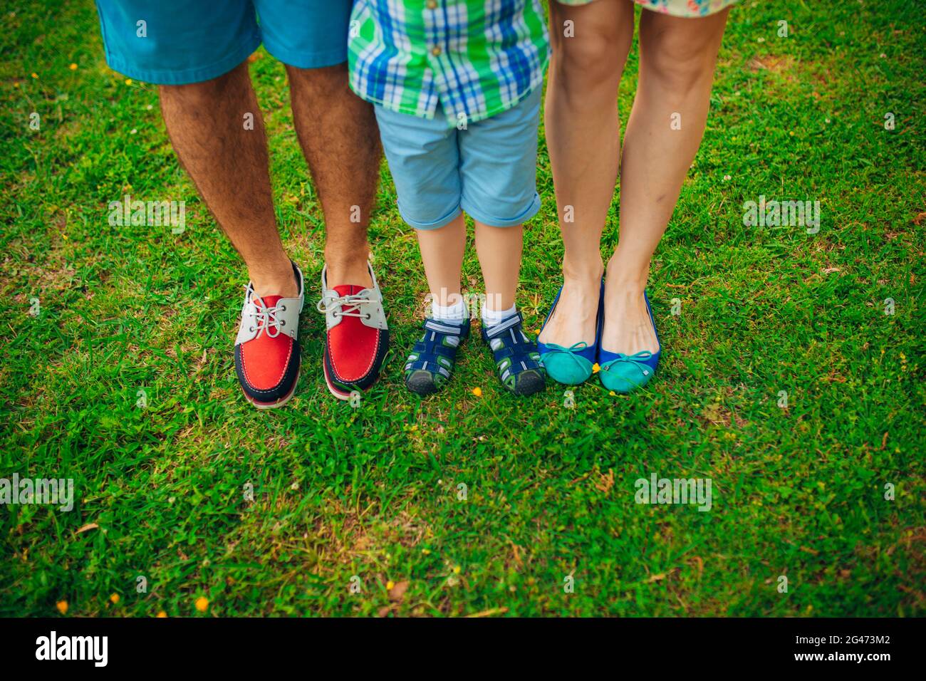 Children s Legs And Feet Of Parents The Family Walks Along The Beach children-s-legs-and-feet-of-parents-the-family-walks-along-the-beach