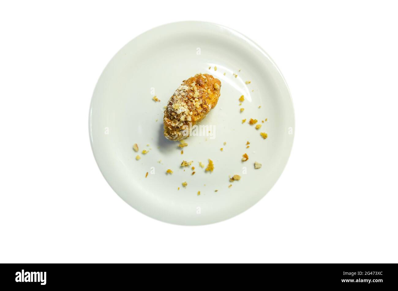 Top view of pastry and crumbs on a white plate Stock Photo - Alamy