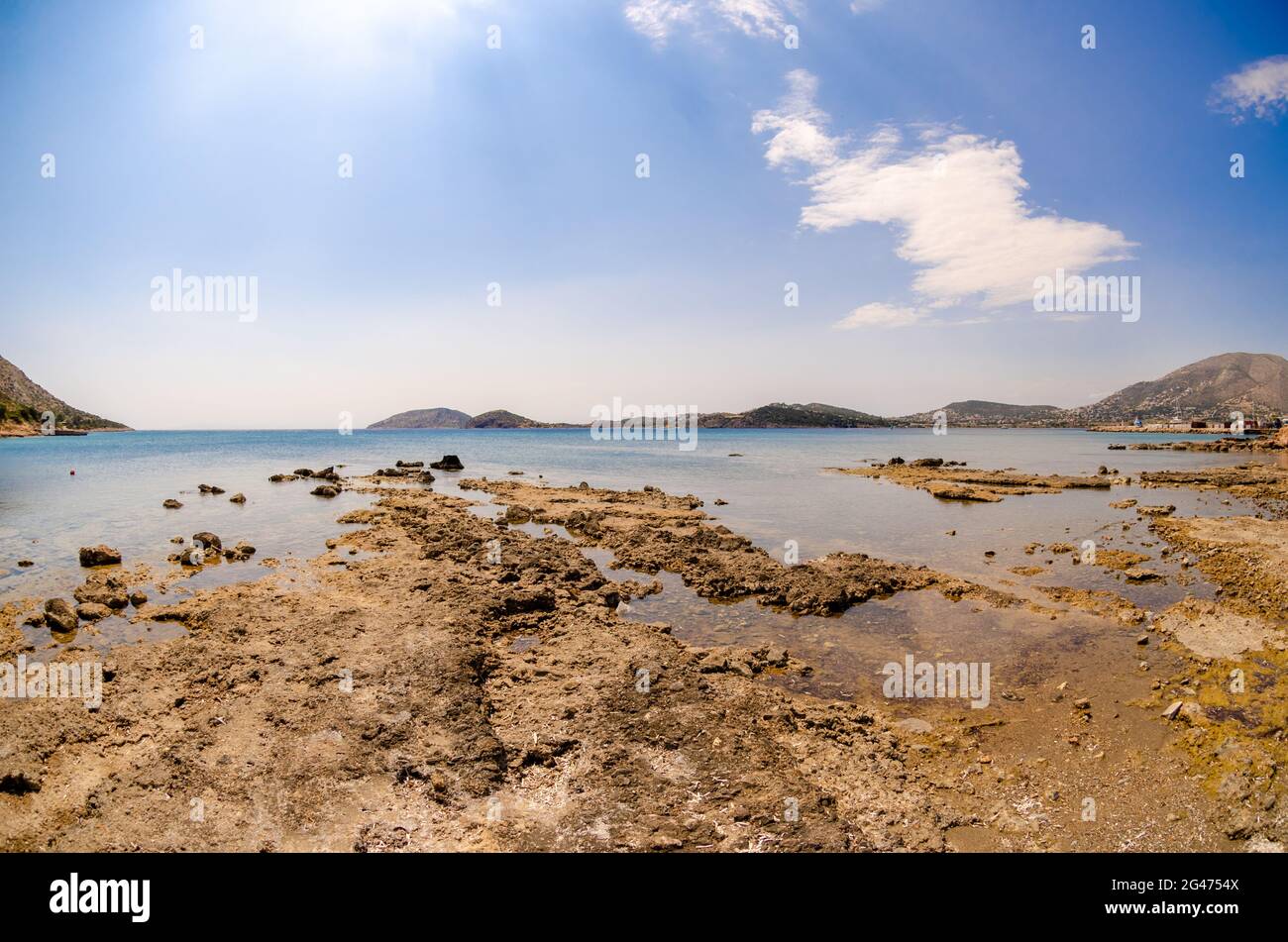 Blue sea and rocky beach in Anavyssos, Greece Stock Photo - Alamy