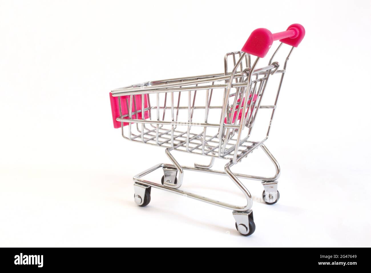 Mini shopping cart, closeup pink empty shopping cart isolated on white ...