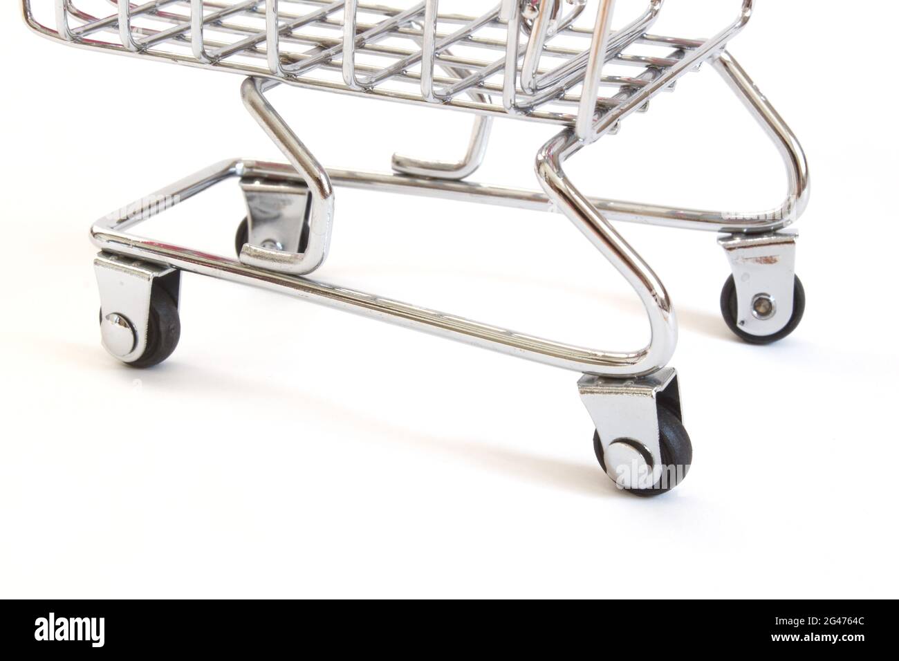 Shopping trolley or cart wheels close-up, isolated on white background ...