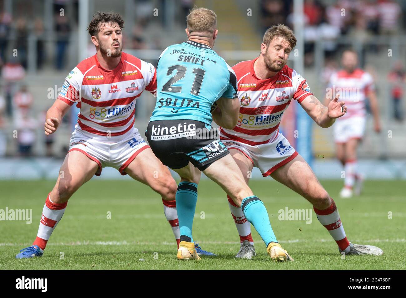 Leigh, UK. 19 June 2021. Adam Swift (21) of Hull FC tackled during the ...