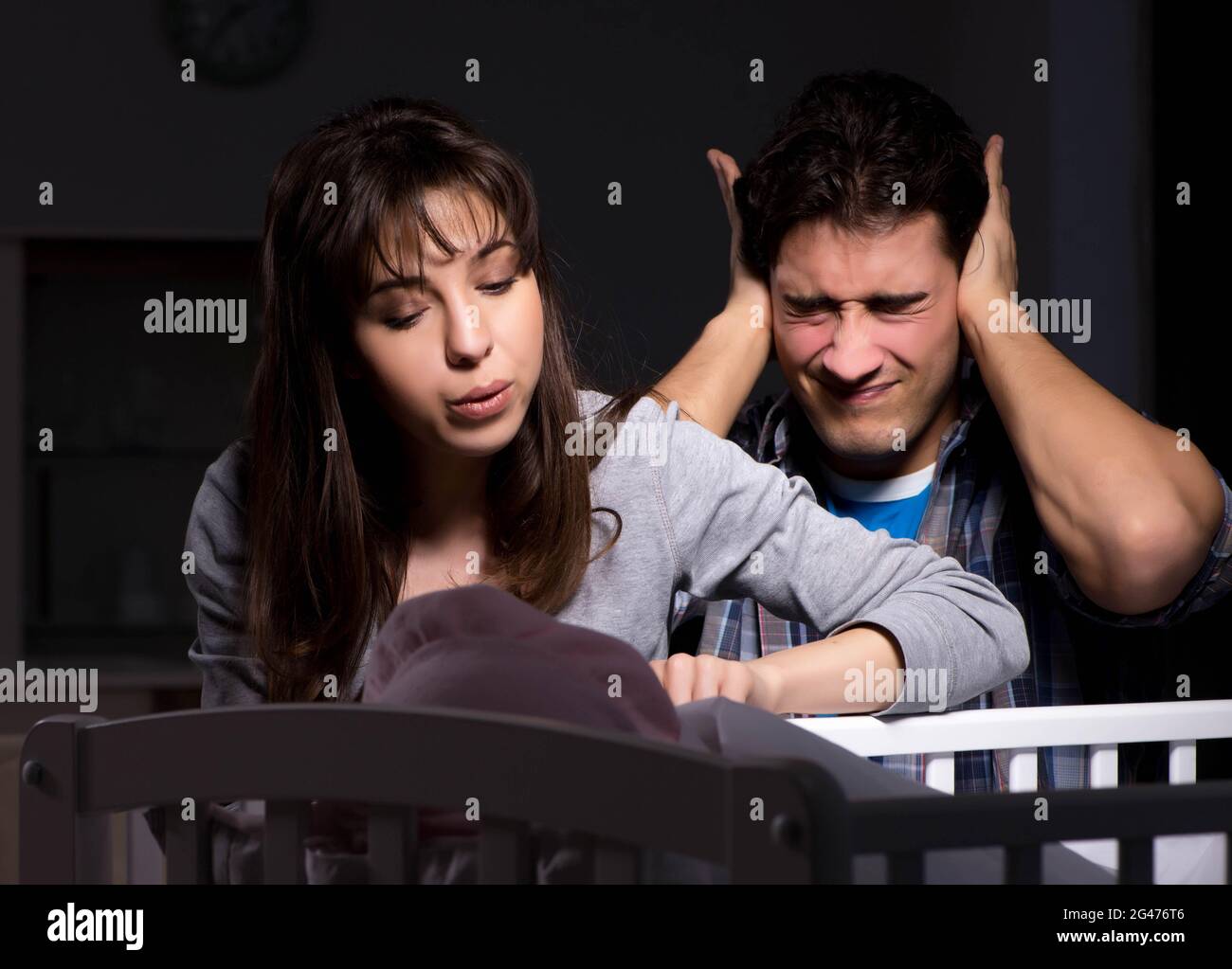 The young parents sleepless with newborn baby at night Stock Photo - Alamy