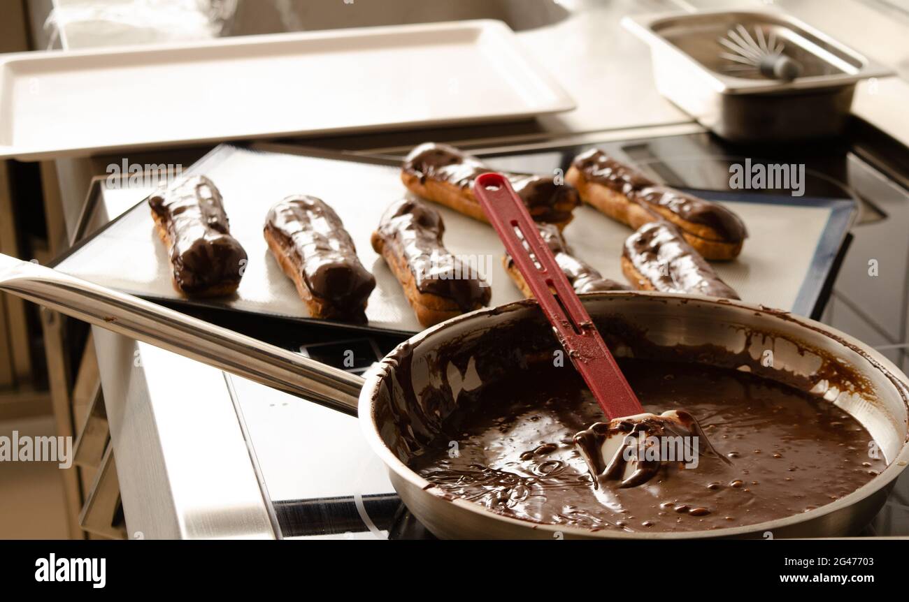 Soft focus of a melted chocolate and eclairs at a bakery Stock Photo ...