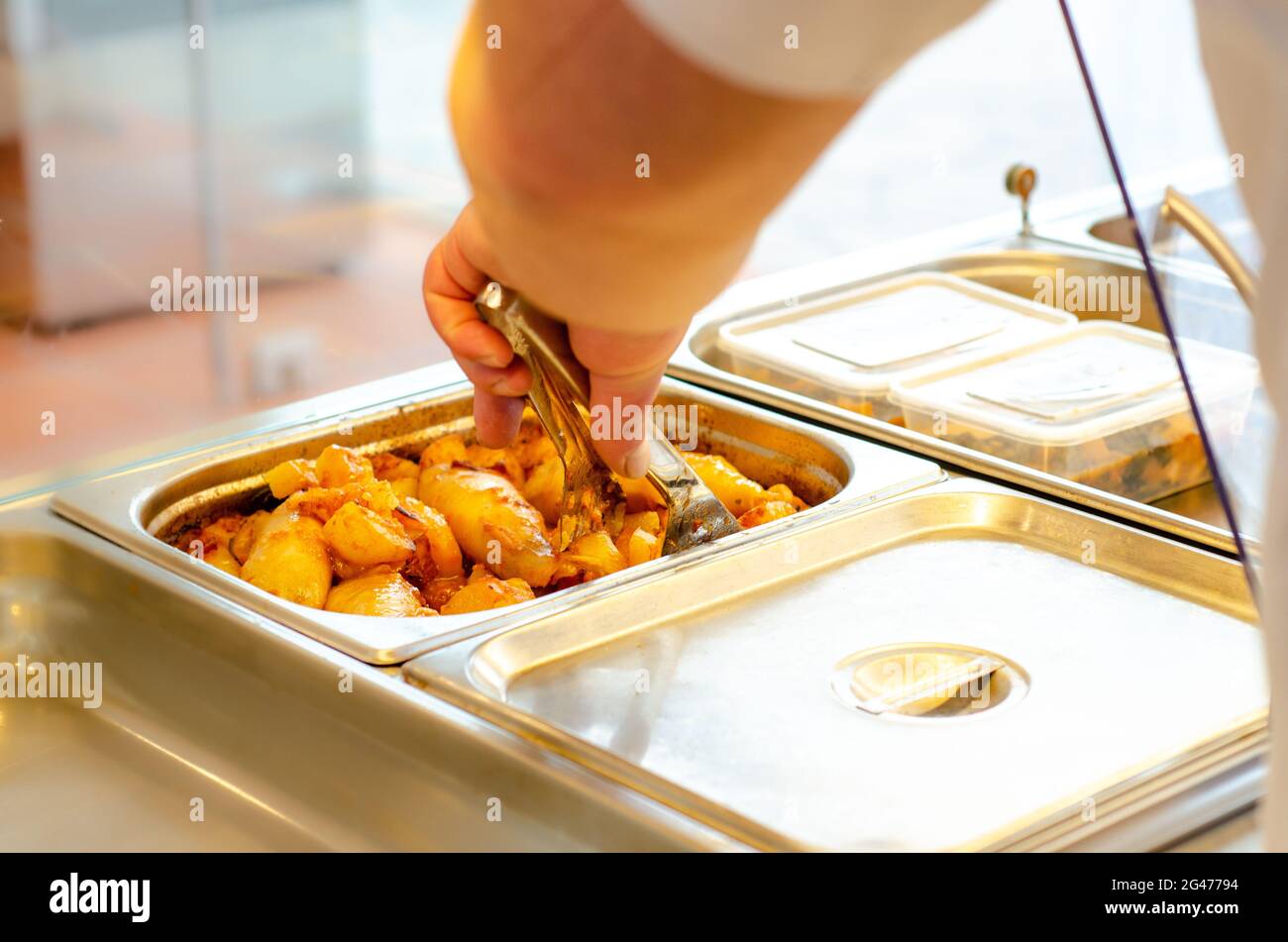 Soft focus of a caterer serving food at a party Stock Photo - Alamy