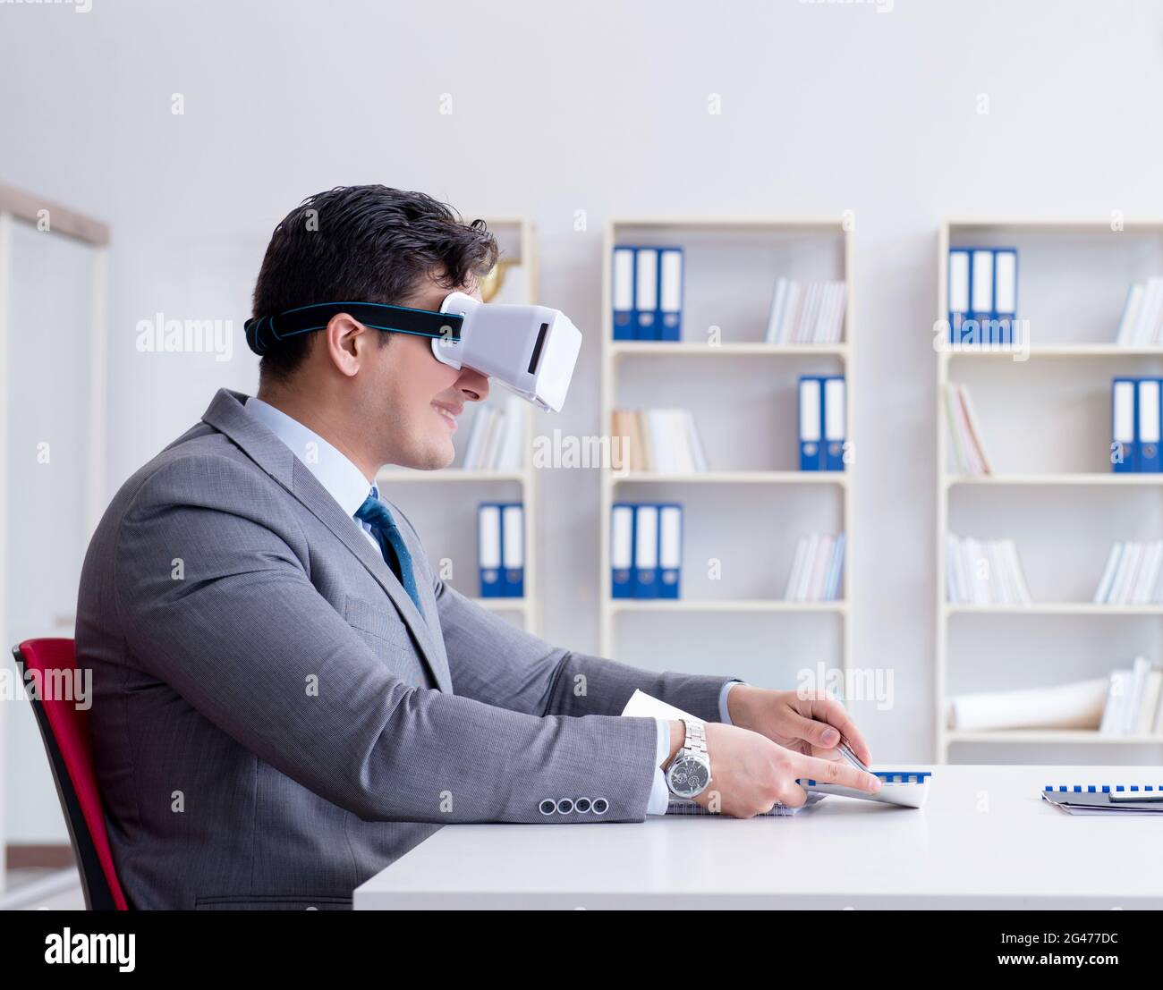 The businessman with virtual reality glasses in the office Stock Photo ...