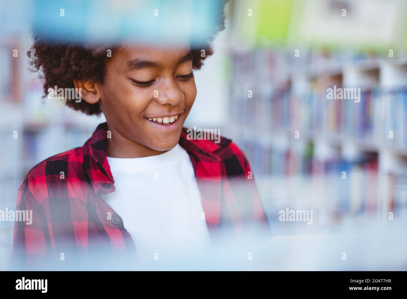 African boy reading book library hi-res stock photography and images ...