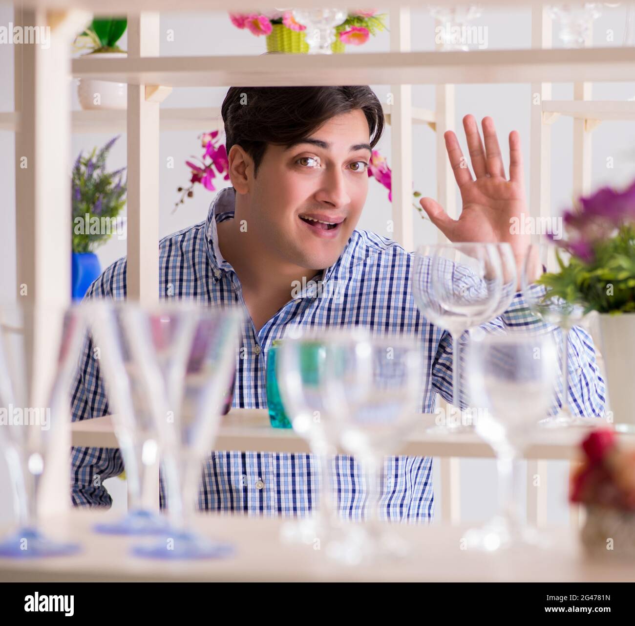 The young handsome man shopping in shop Stock Photo - Alamy