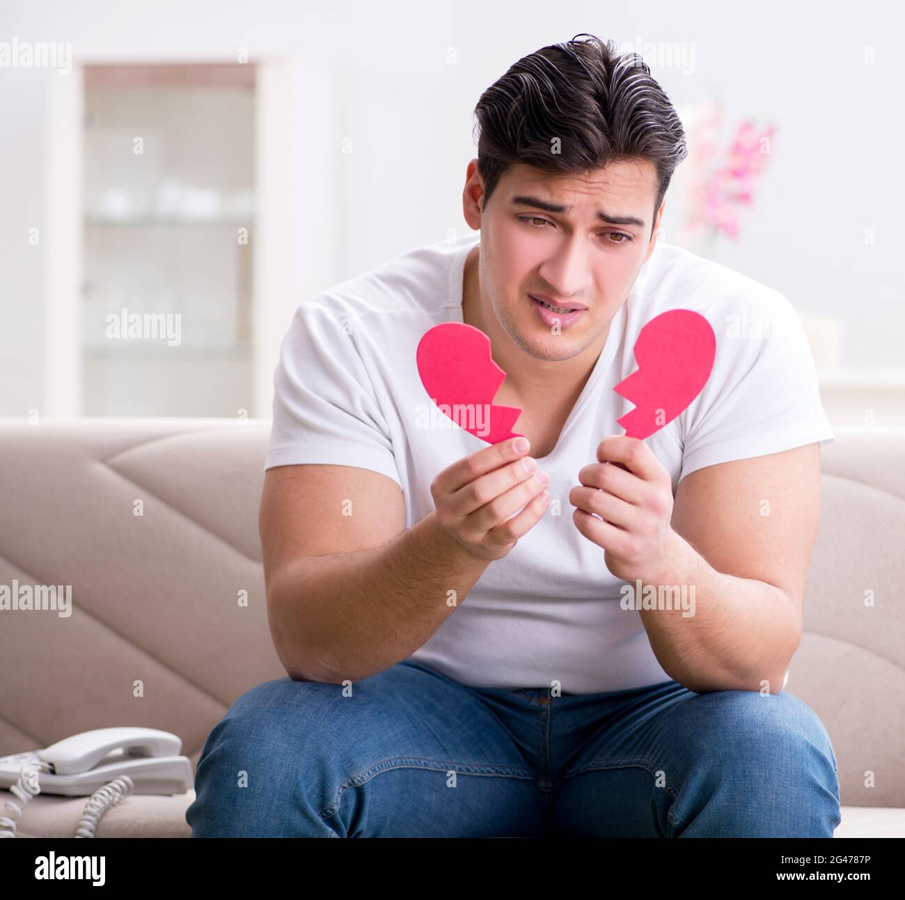 The young man in sad saint valentine concept Stock Photo - Alamy