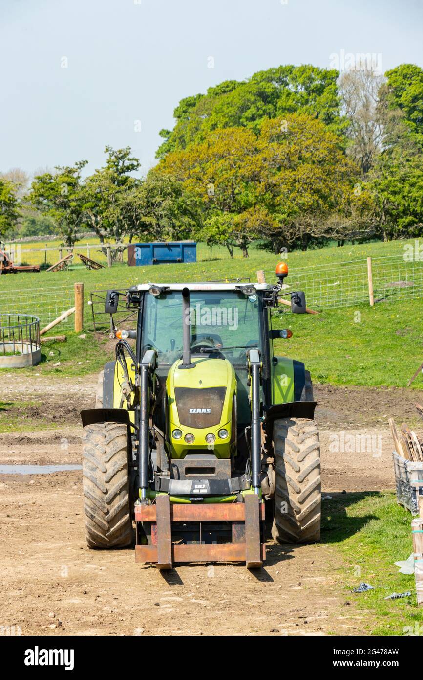 green Klaas tractor on farm front view Stock Photo - Alamy