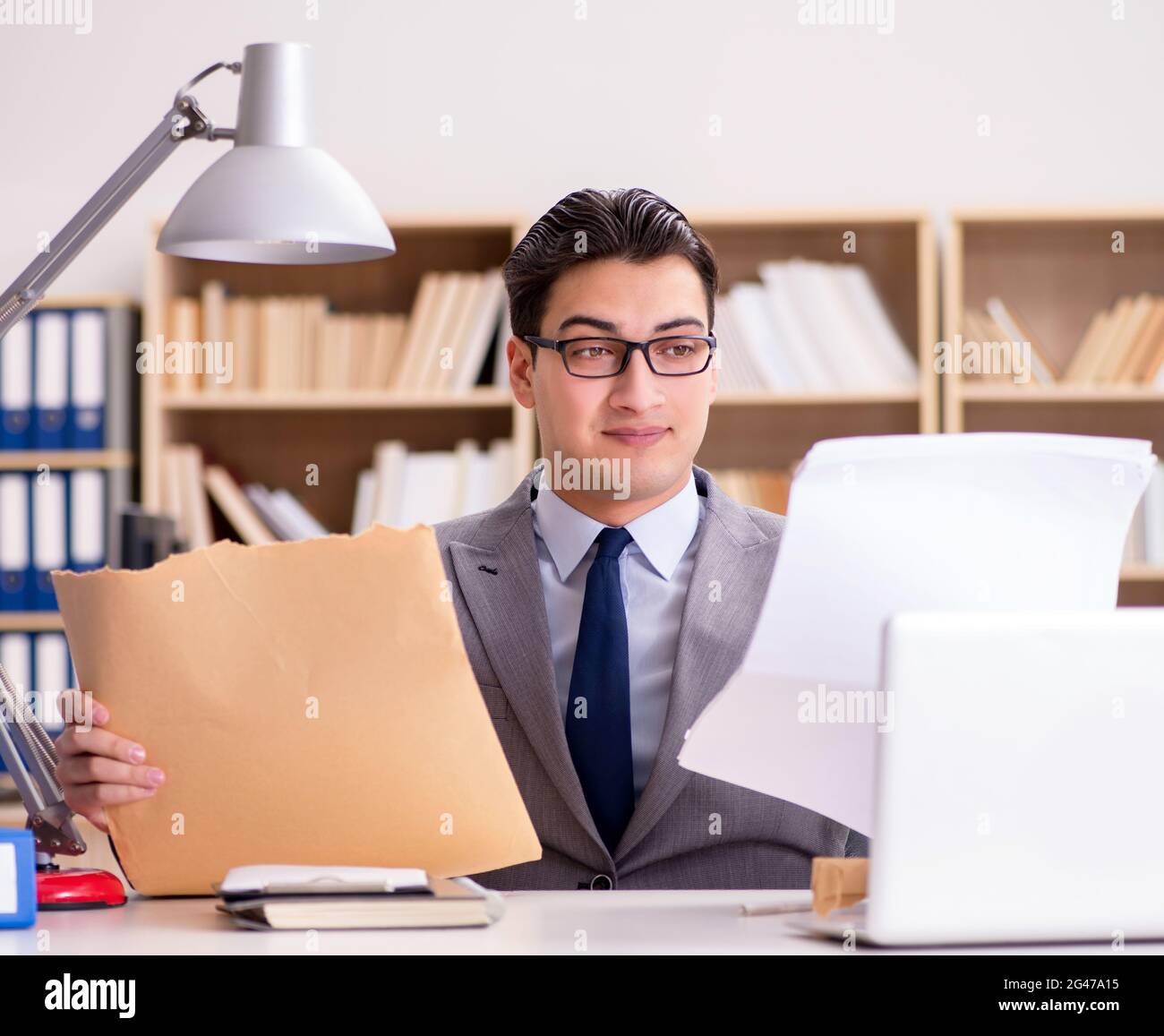 The businessman receiving letter in the office Stock Photo - Alamy